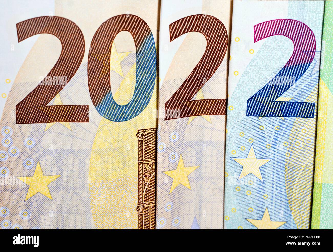 The year 2022 laid with euro notes, studio photography with black ...