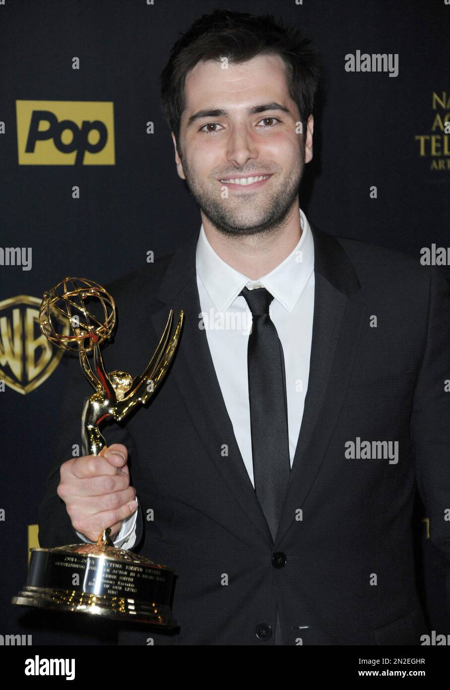 Freddie Smith poses in the pressroom with the award for outstanding ...