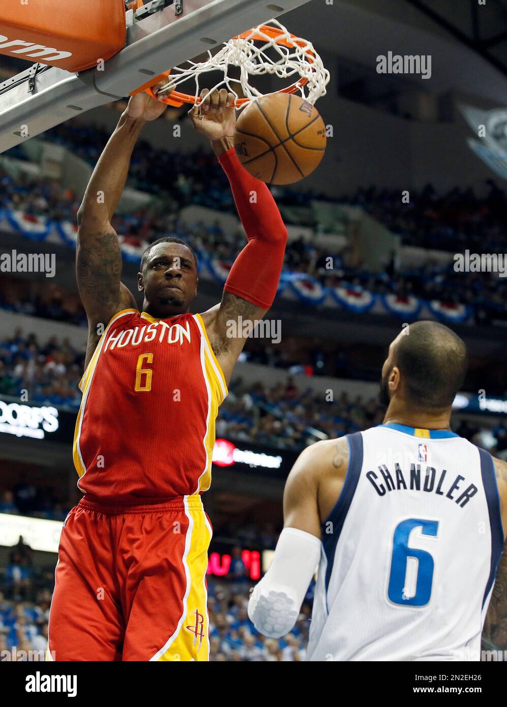 Houston Rockets' Terrence Jones (6) dunks the ball over Dallas ...