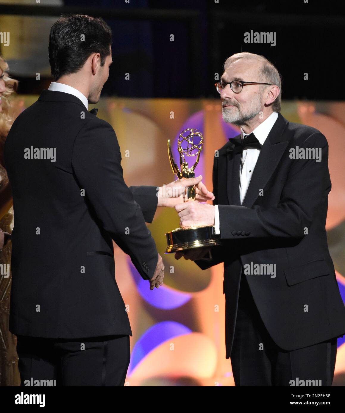 Ryan Paevey, left, presents Rand Morrison with the award for ...