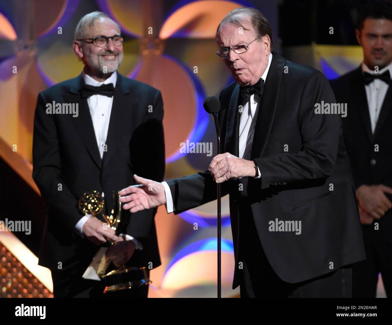 Rand Morrison, left, and Charles Osgood accept the award for ...
