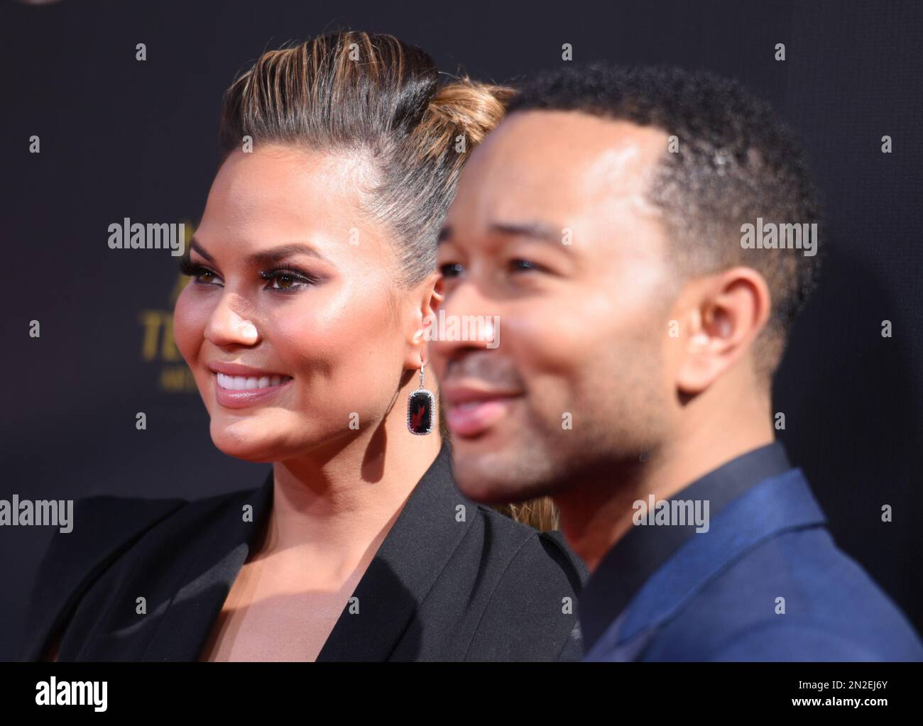 Chrissy Teigen, left, and John Legend arrive at the 42nd annual Daytime ...