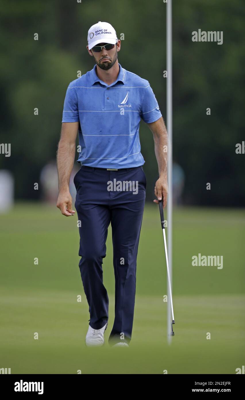 Cameron Tringale reacts as he approaches the 14th green during the ...
