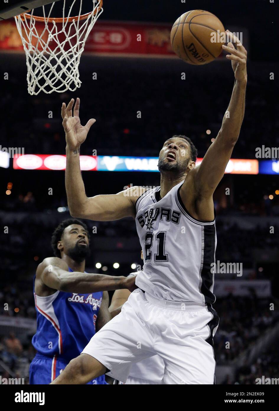 San Antonio Spurs' Tim Duncan (21) grabs a rebound over Los Angeles ...