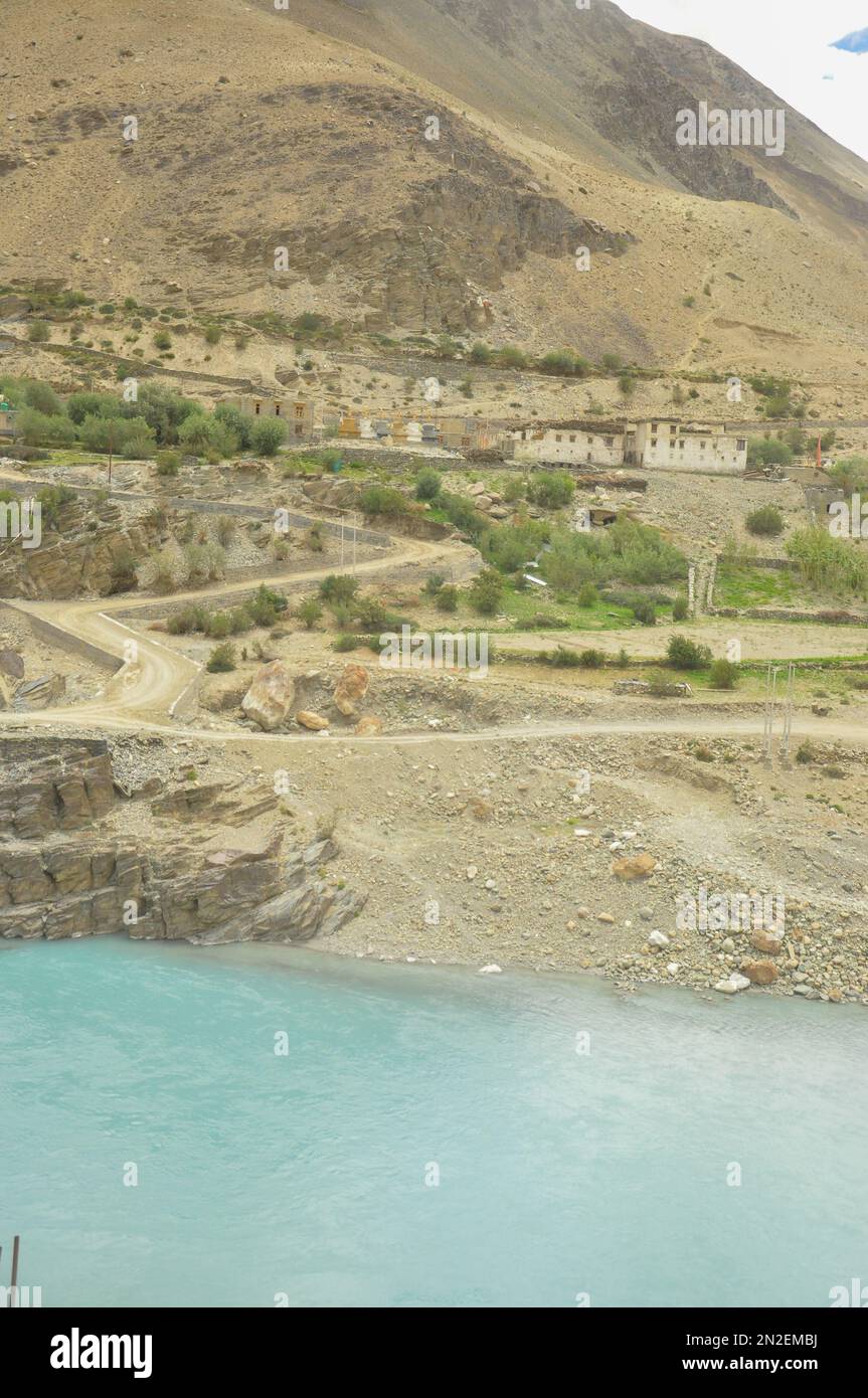Beautiful view of Ladakhi traditional buildings with flowing Indus ...