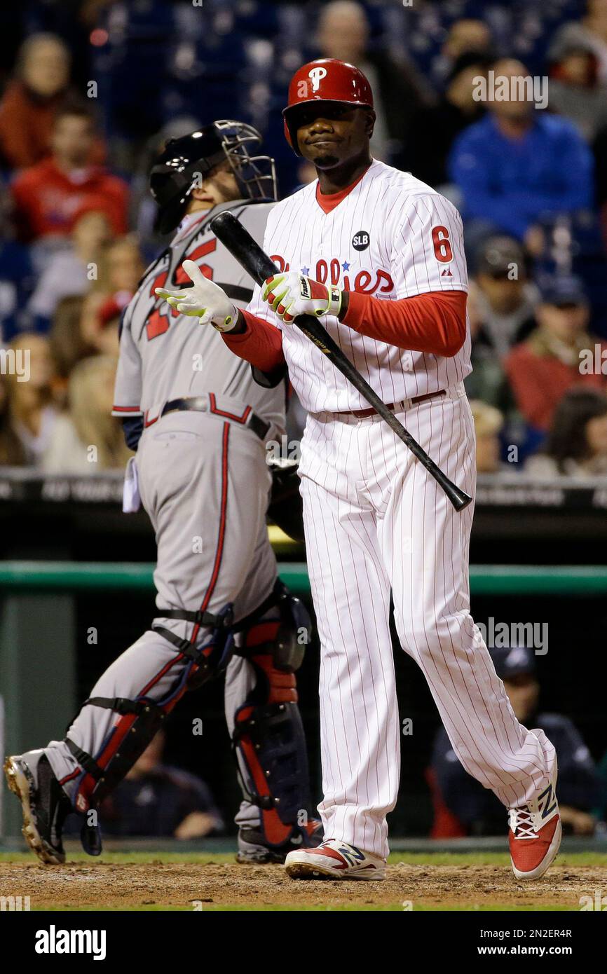 Philadelphia Phillies' Ryan Howard, right, reacts after striking out ...