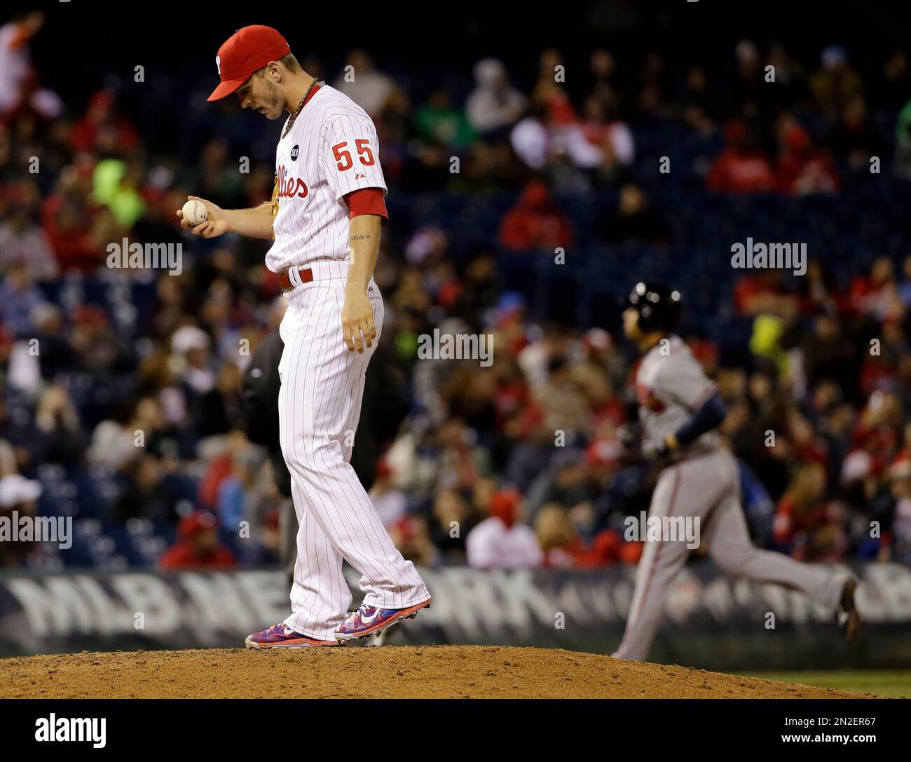 Philadelphia Phillies starting pitcher David Buchanan, left, walks the ...
