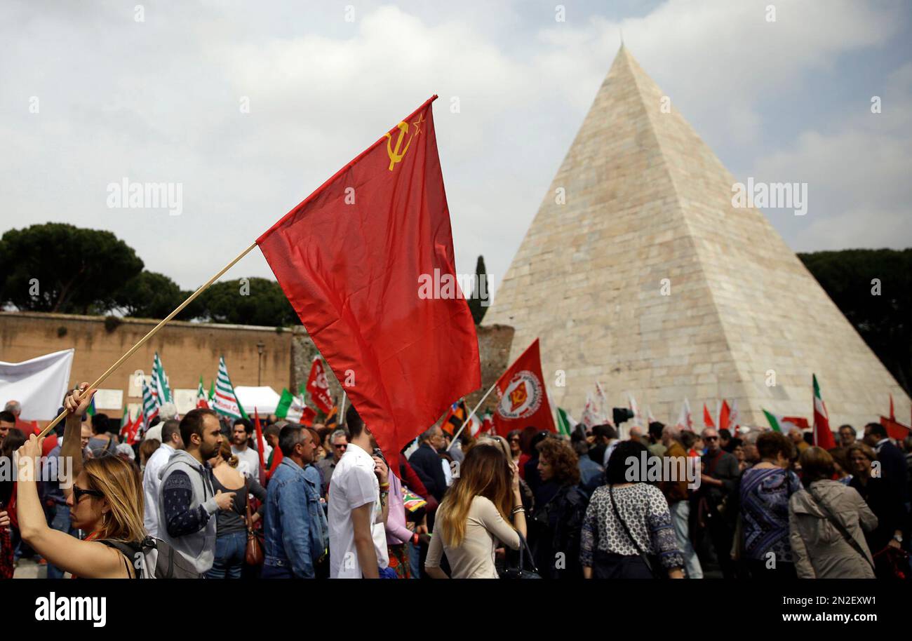 People gather in front of the ancient Pyramid of Cestius during a rally ...