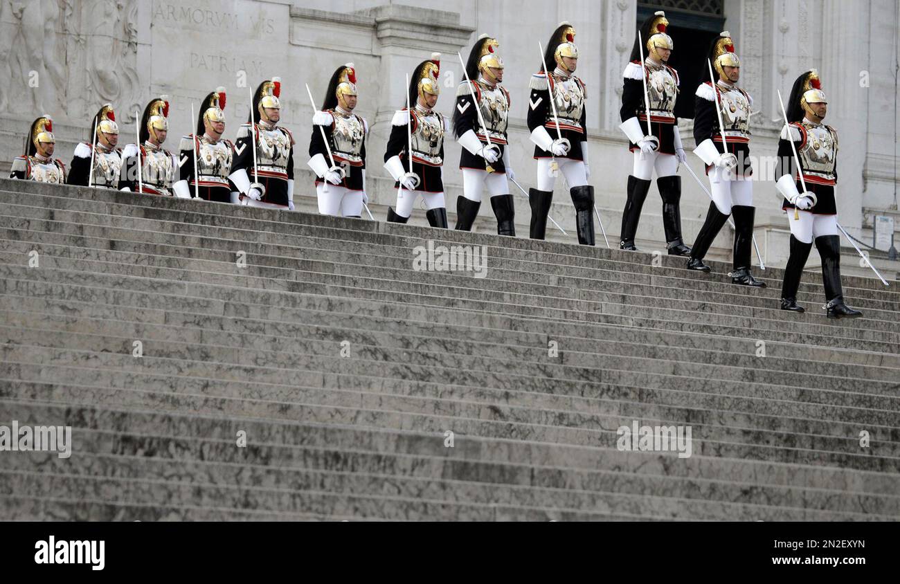 Cuirassier presidential guards descend the steps of the monument to the ...
