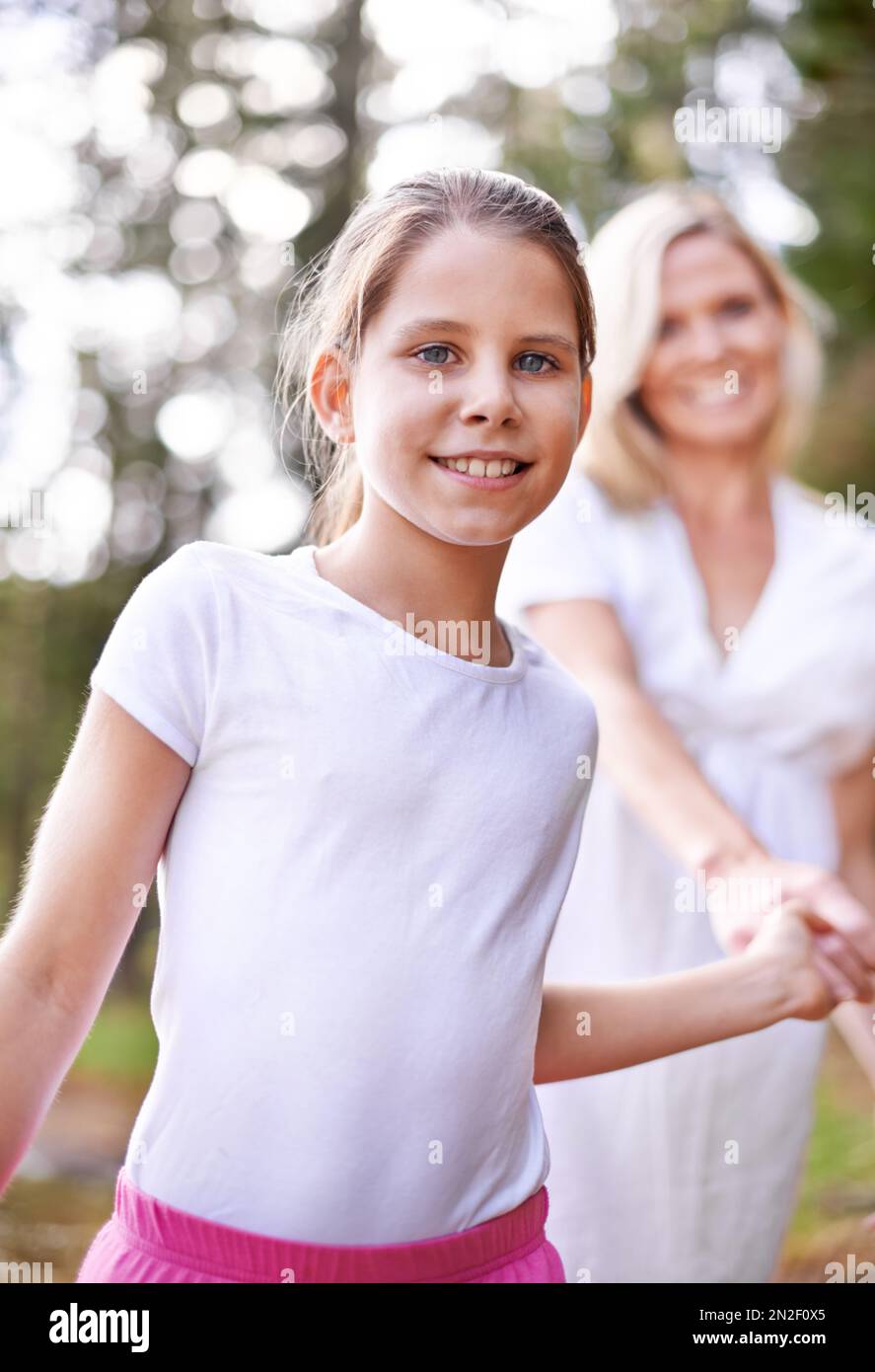 Ill lead the way. A cute little girl leading her mother by the hand ...