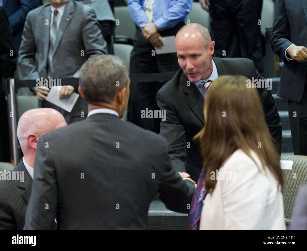 President Barack Obama, left, greets Phillip C. Chudoba, right, the ...