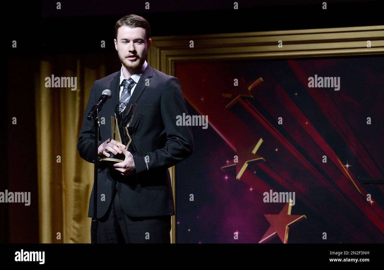 Nick Tustin, of the School of Visual Arts, accepts the 1st Place ...