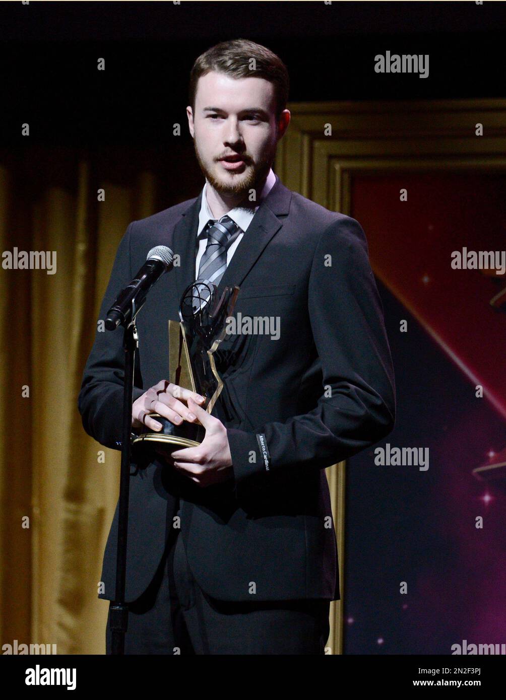 Nick Tustin, of the School of Visual Arts, accepts the 1st Place ...
