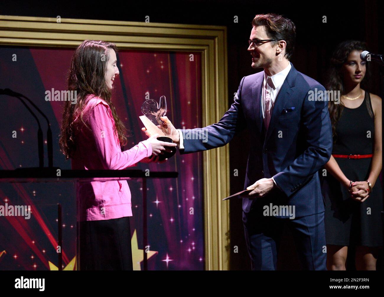 Matt Bomer, right, presents the Bricker Humanitarian award to Melissa ...