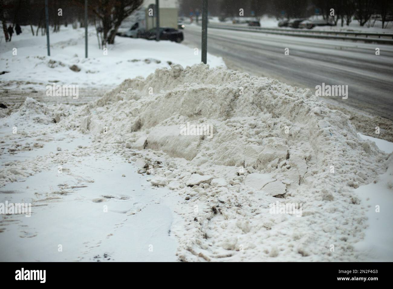 Snow on side of road. Snow removed from track. Details of road in ...