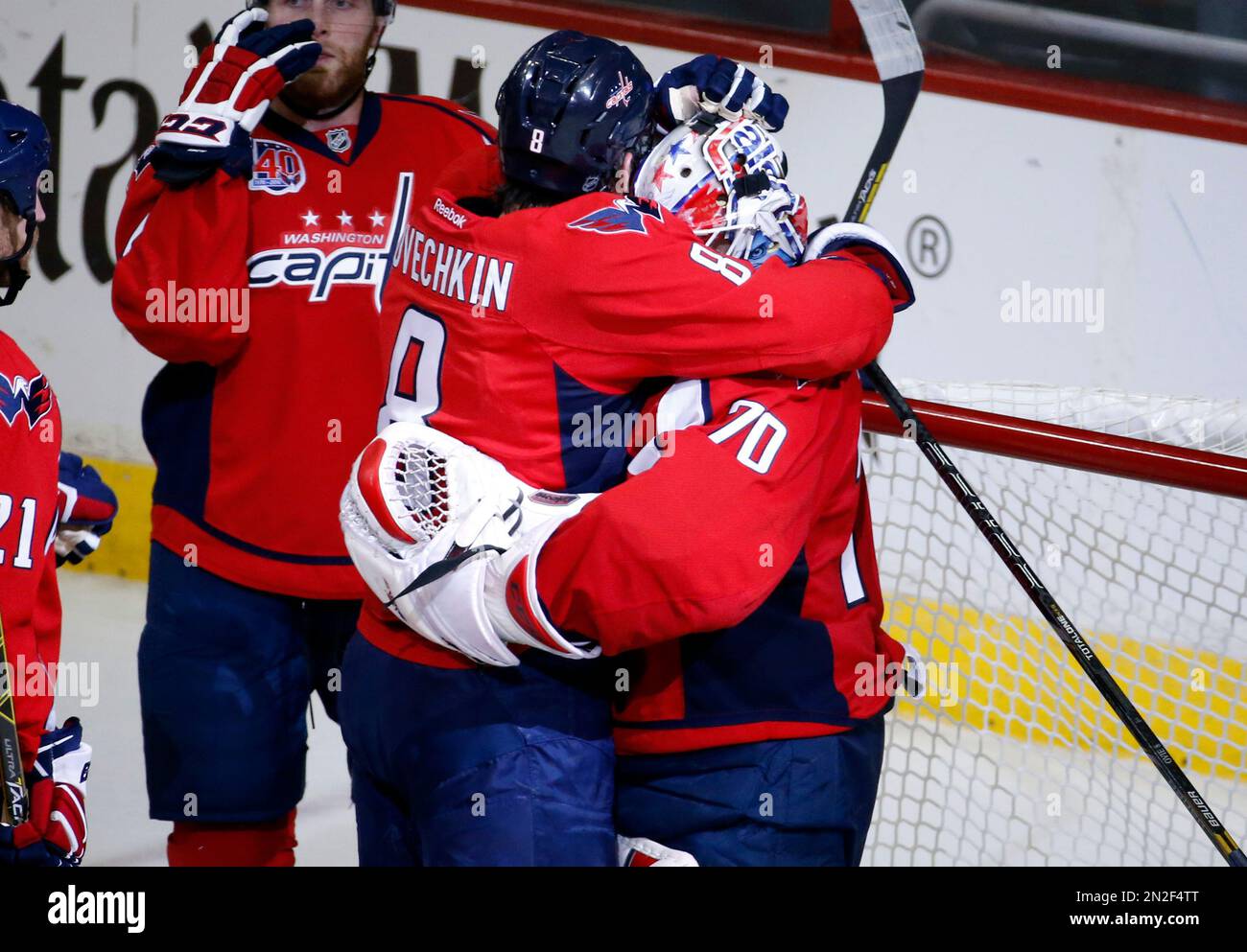 Washington Capitals left wing Alex Ovechkin (8), from Russia, embraces ...