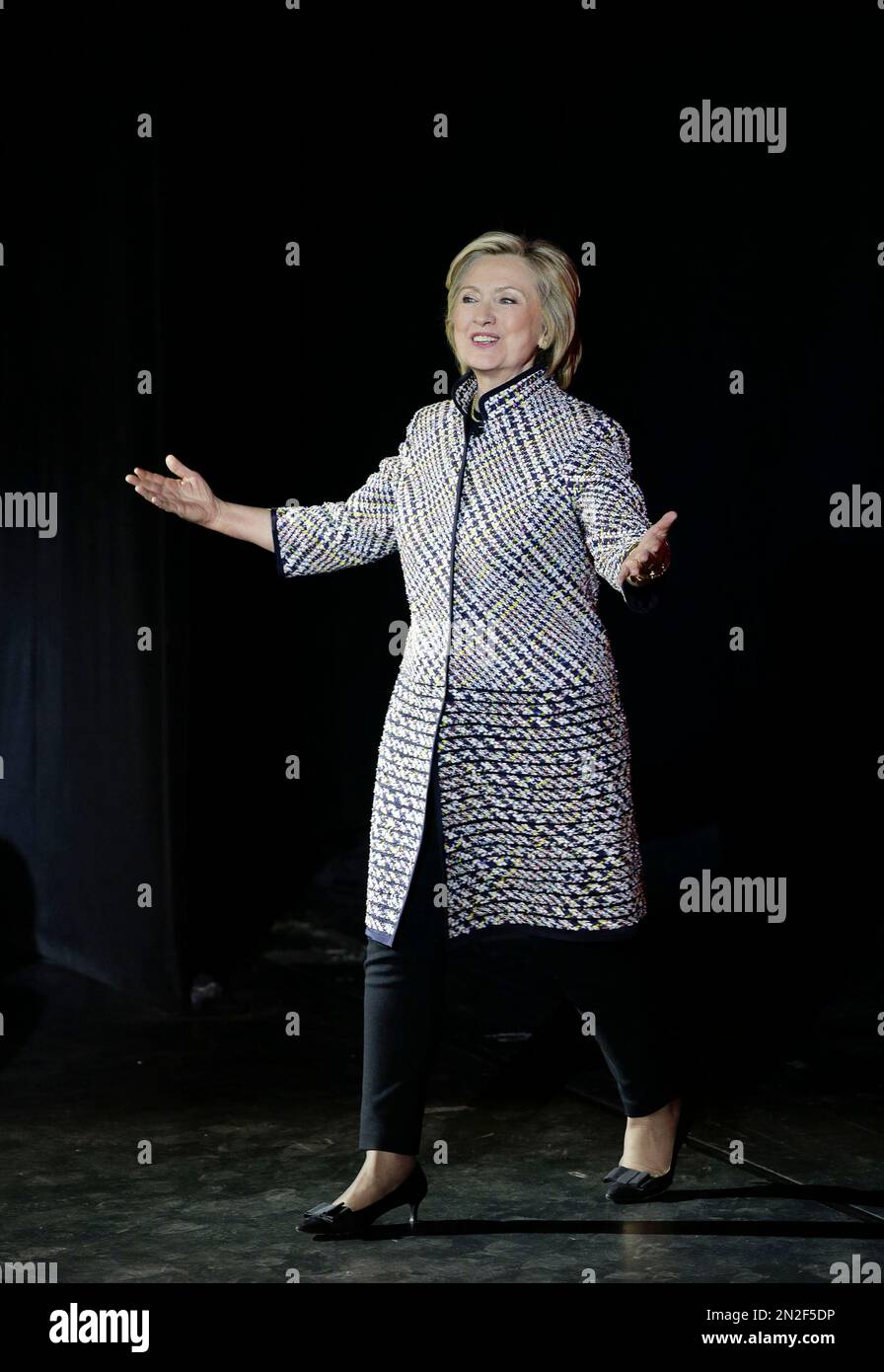 Hillary Clinton reacts to applause from the crowd before speaking ...