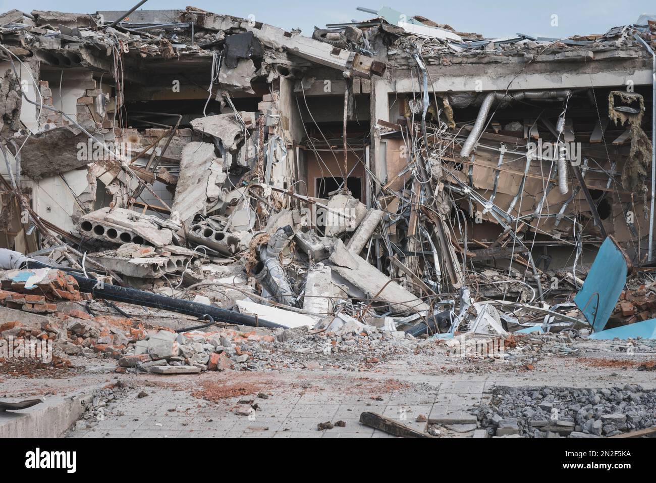 The wreckage of a destroyed building. Ruins in the background Stock ...