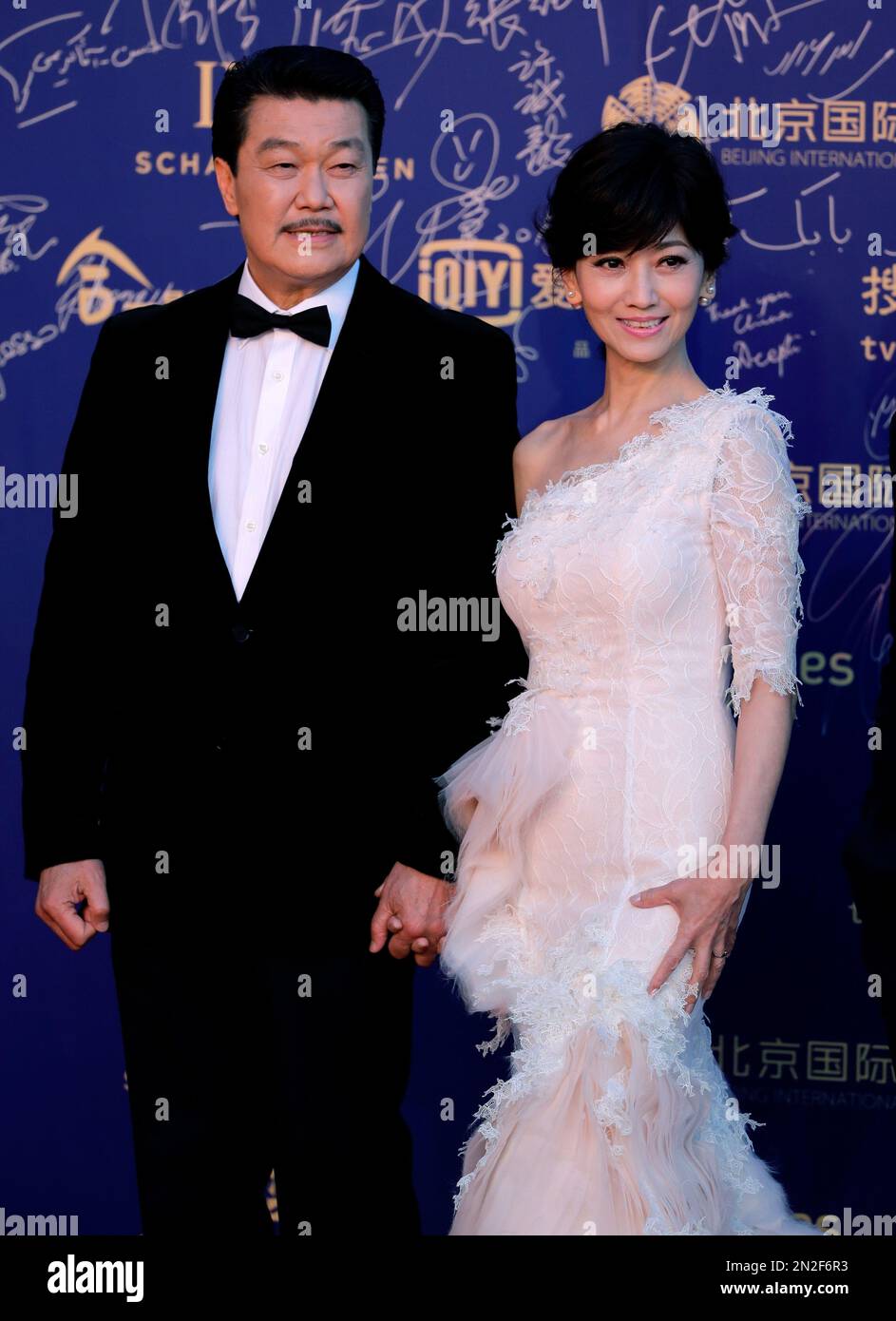Hong Kong actress Angie Chiu, right, and her husband Melvin Wong pose for photographers on the ...