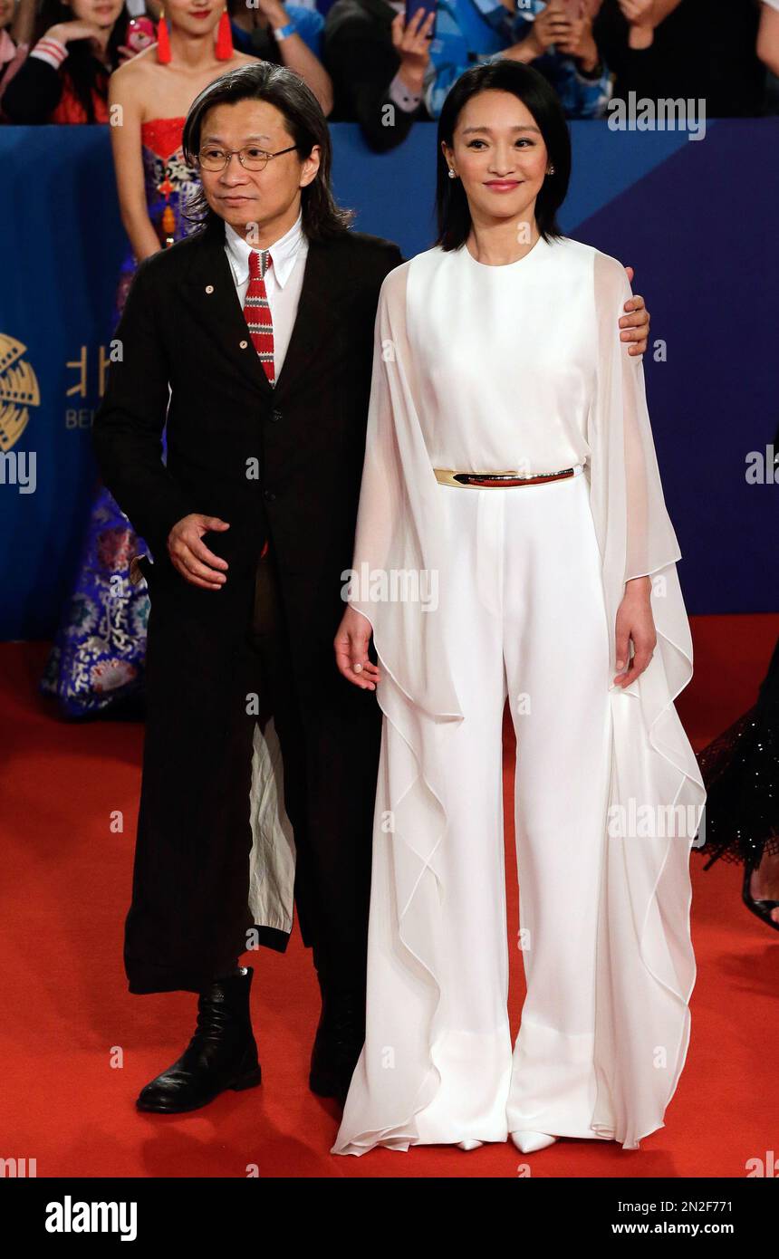 Chinese actress Zhou Xun, right, and Hong Kong director Peter Chan pose ...
