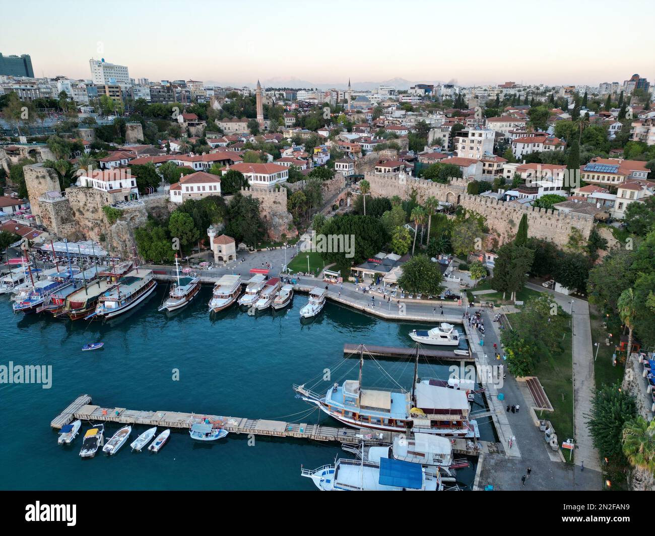 An aerial view of cityscape Antalya surrounded by buildings and water ...