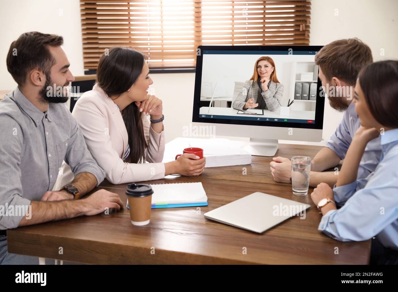 Coworkers in video conference hi-res stock photography and images - Alamy