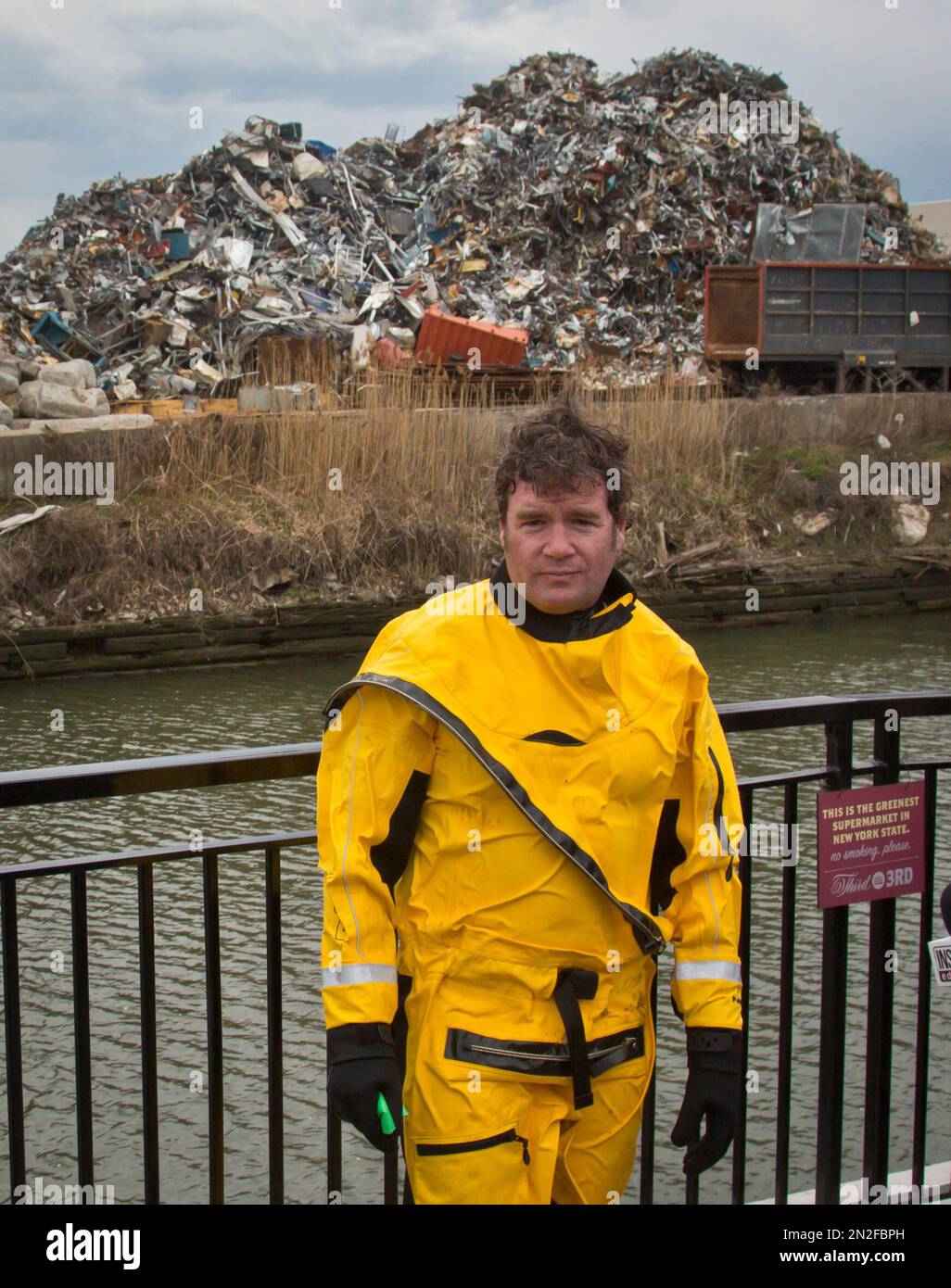 Clean-water advocate Christopher Swain listens during a media ...