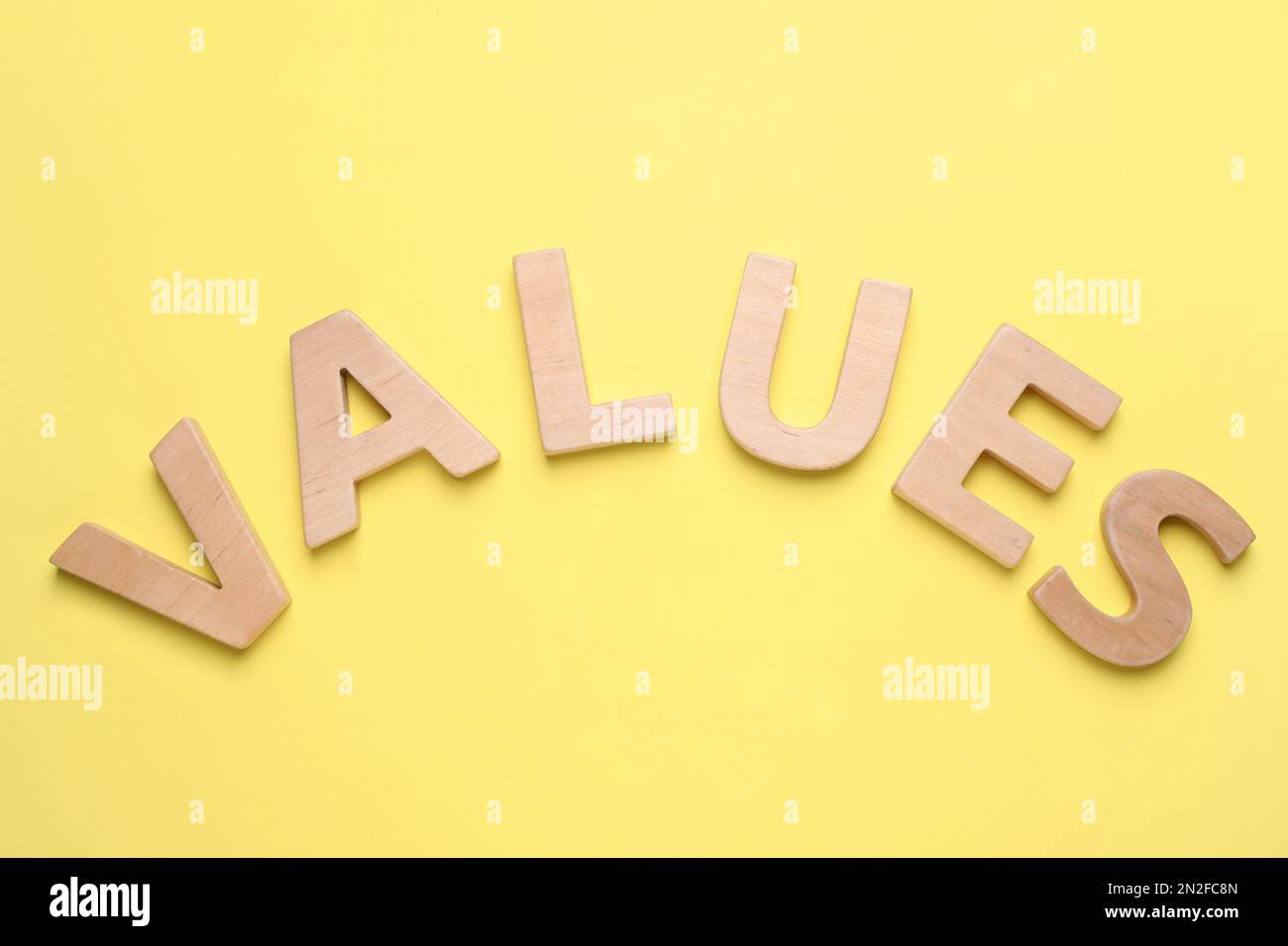 Word VALUES made of wooden letters on yellow background, flat lay Stock ...
