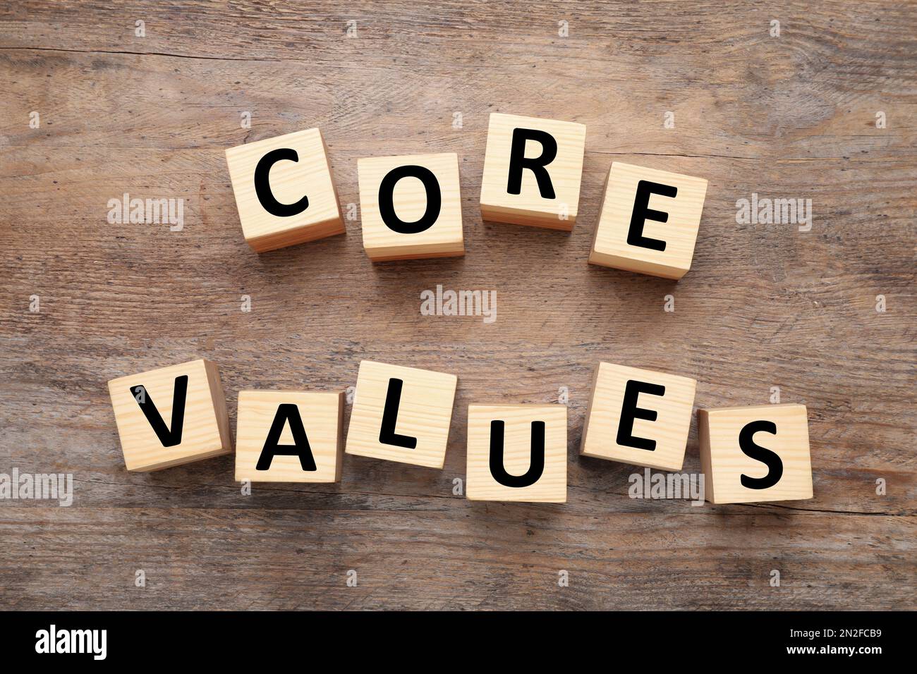 Cubes with phrase CORE VALUES on wooden background, flat lay Stock ...
