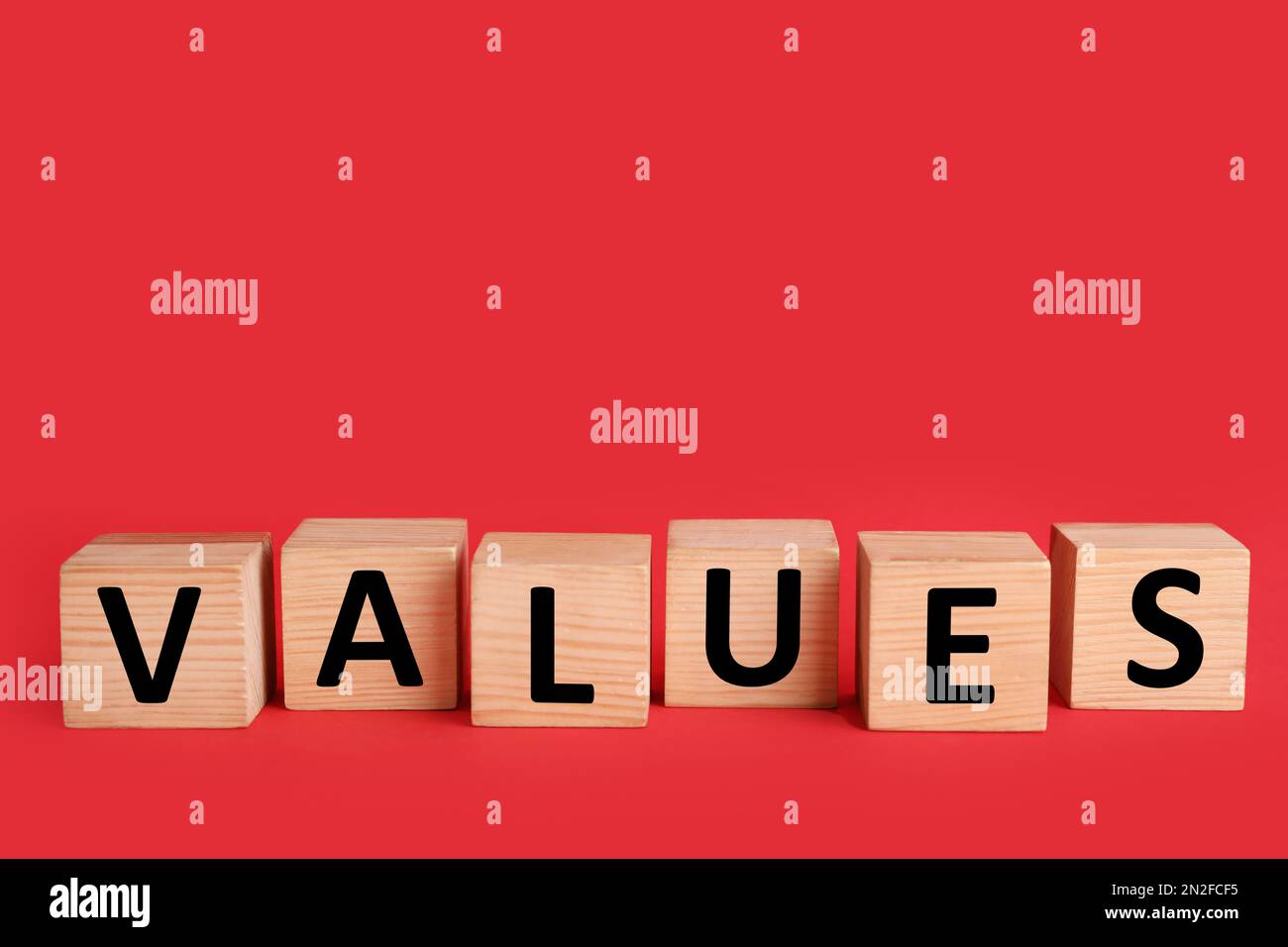 Wooden cubes with word VALUES on red background Stock Photo - Alamy