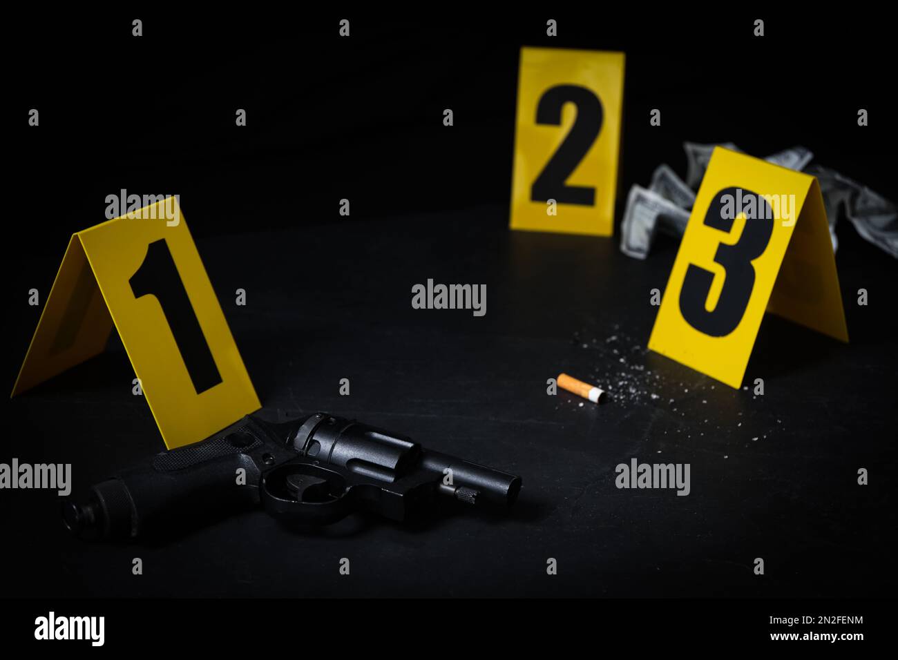 Crime scene markers and evidences on black background Stock Photo - Alamy