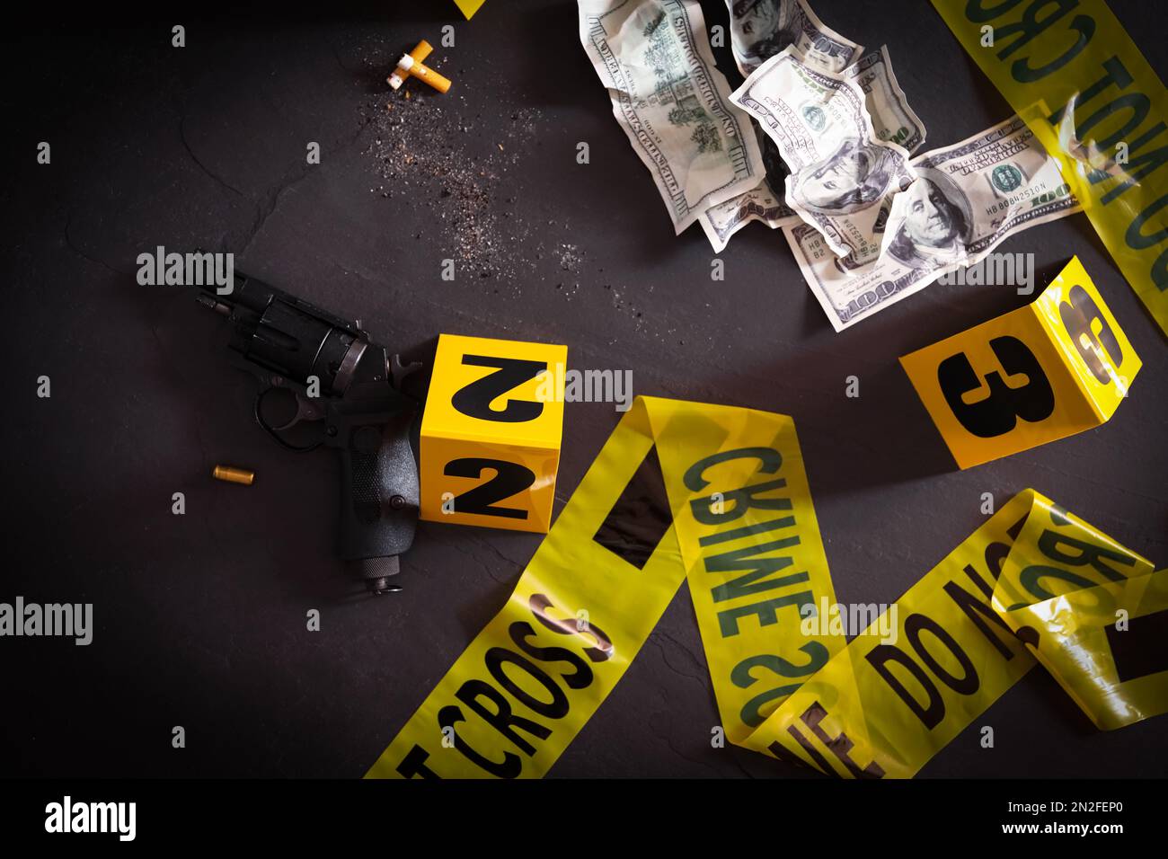 Flat lay composition with evidences and crime scene markers on black ...