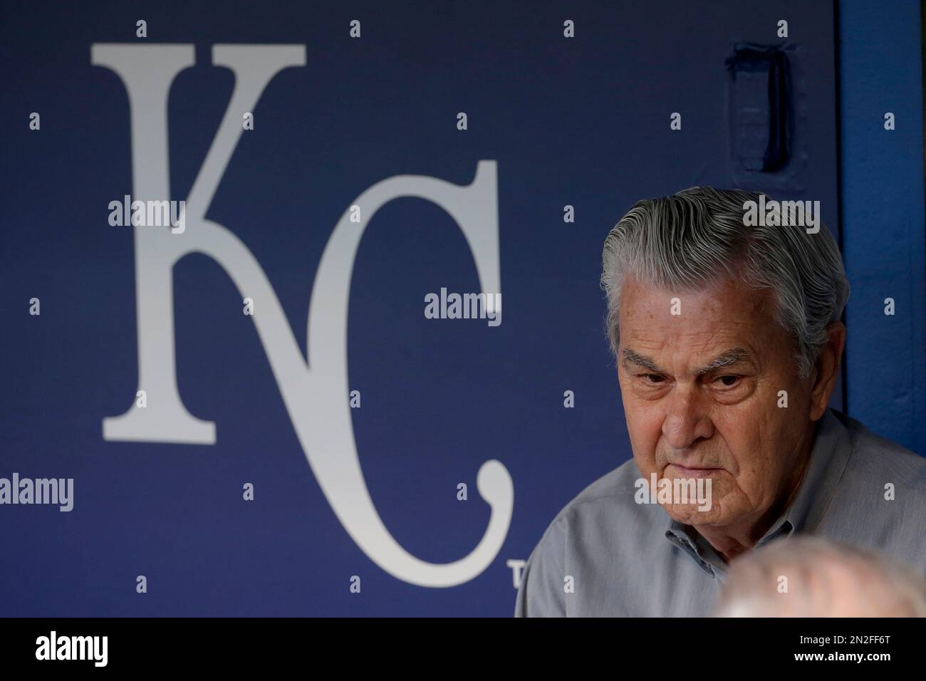Kansas City Royals owner David Glass sits in the dugout before a ...