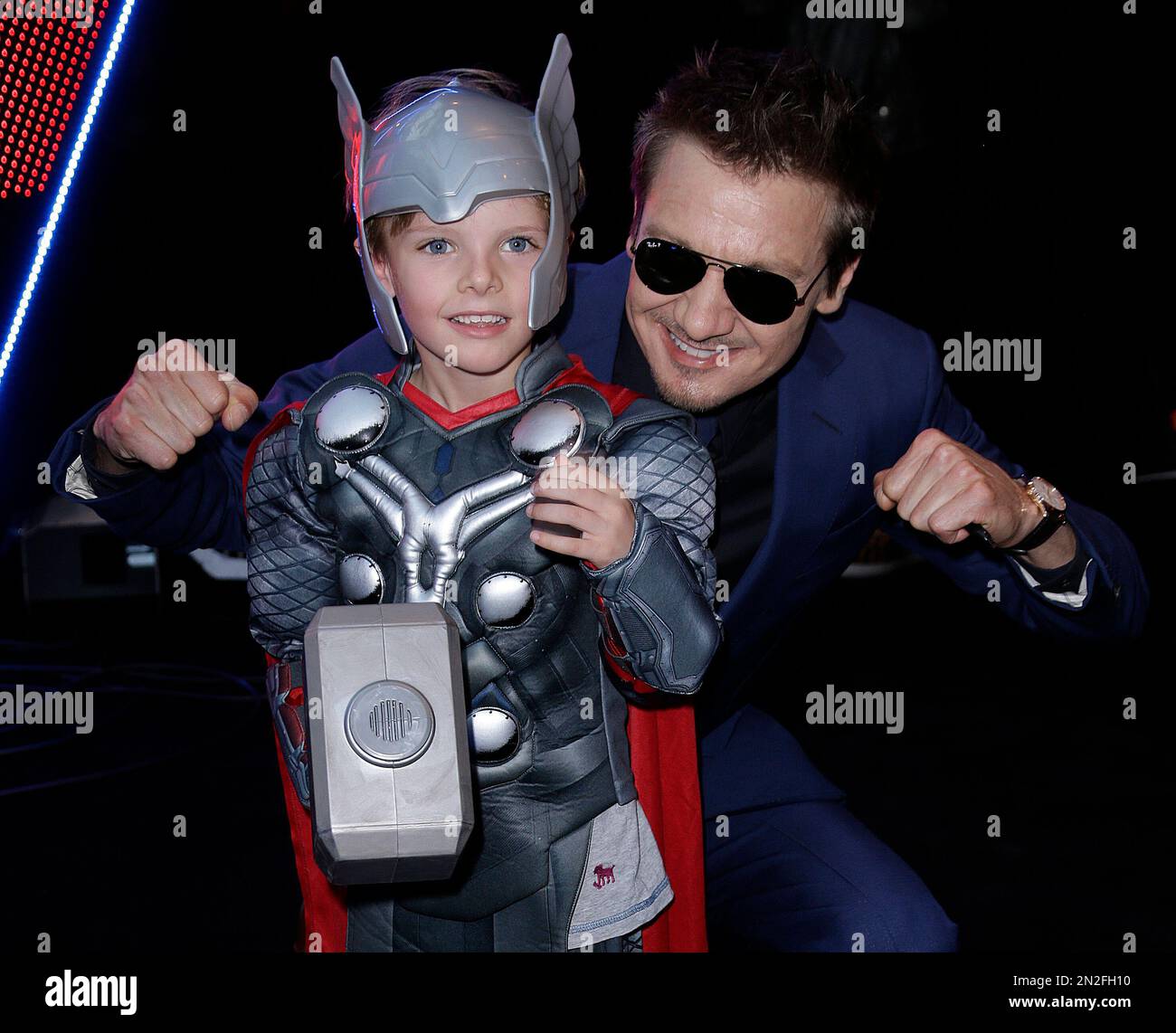 Jeremy Renner and a young Thor fan pose for photographers upon arrival ...