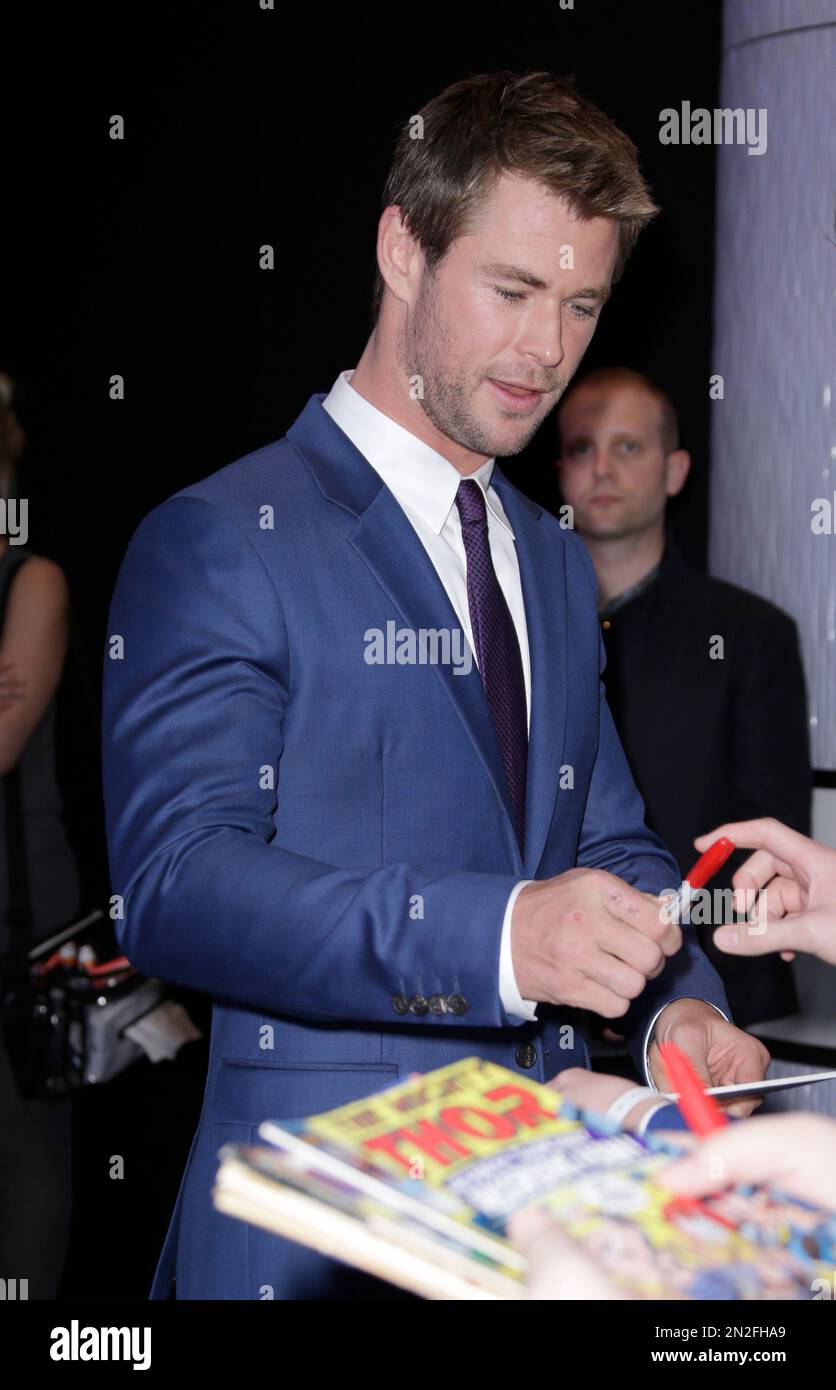 Chris Hemsworth signs autographs at the premiere for the film 'The ...