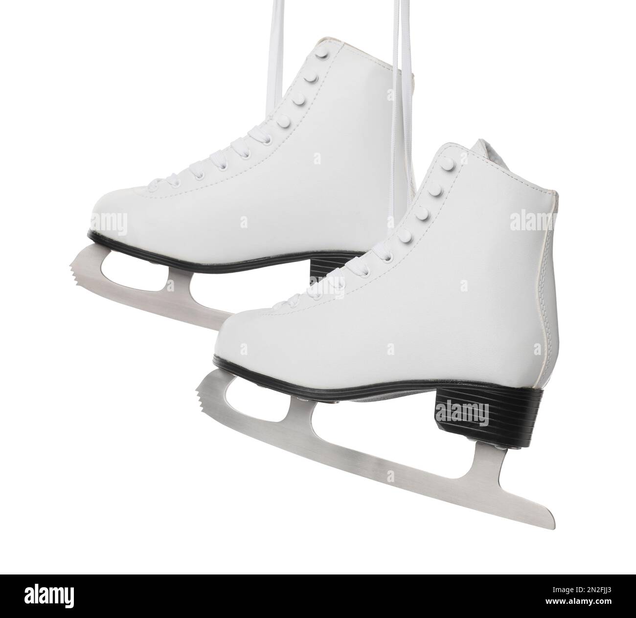 Pair of figure ice skates hanging on white background Stock Photo - Alamy