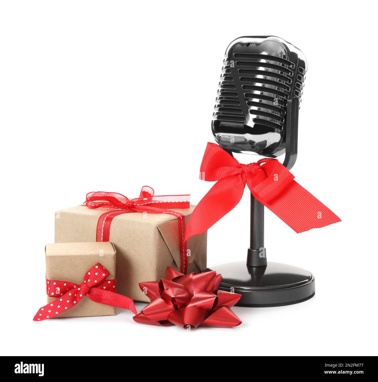 Retro microphone with red bow and gift boxes on white background ...