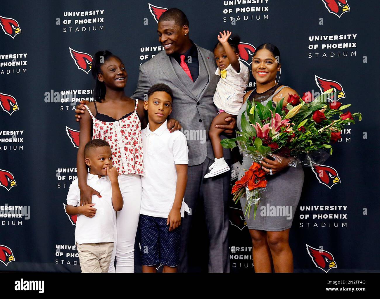 Arizona Cardinals' Adrian Wilson poses with his wife, Alicia, right ...