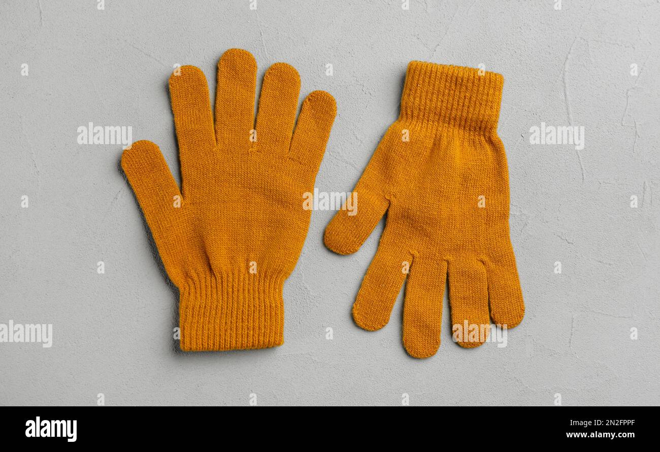 Grey warm knitted gloves hi-res stock photography and images - Alamy