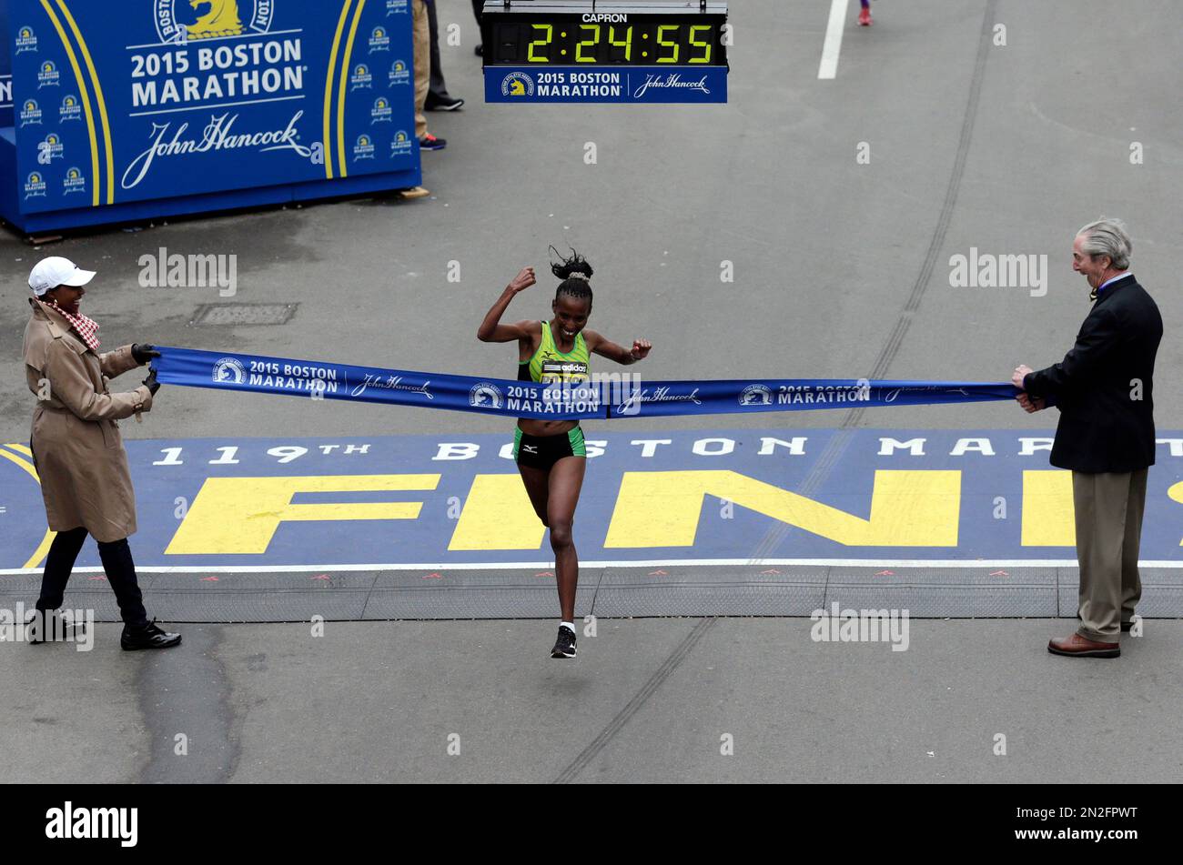 Caroline Rotich, of Kenya, wins the women's division of the Boston ...