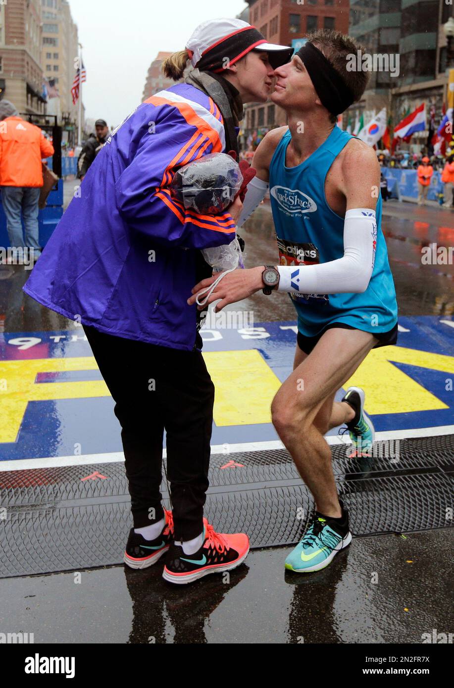Dustin Hicks, right, of Temple Terrace, Fla, kisses Laura Bowerman ...