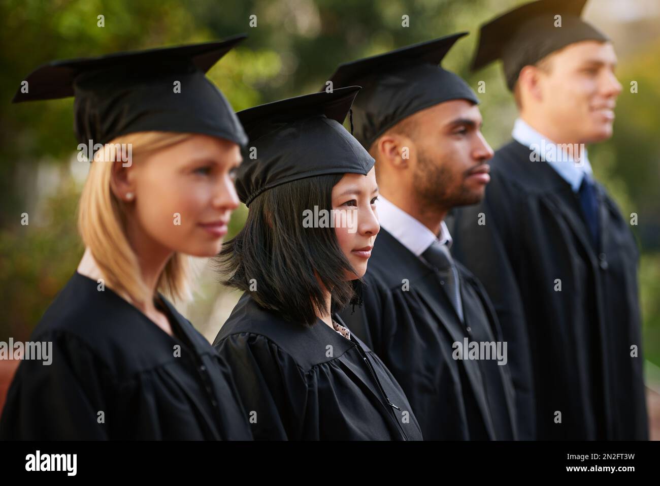 Graduation is not the end, its the beginning. a group of young college ...