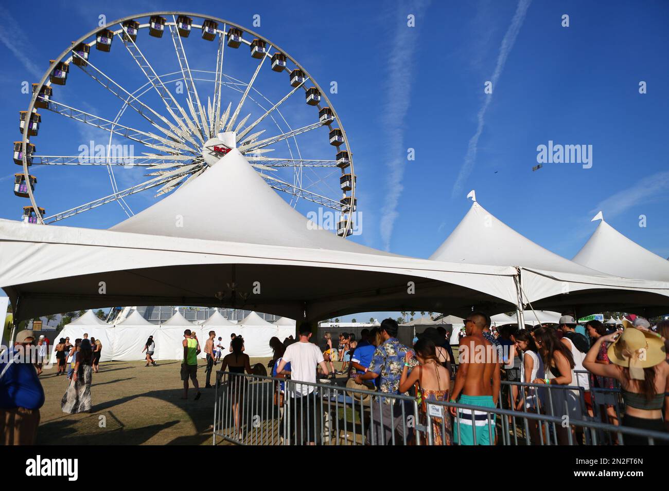 Festival-goers enter through the main gate at the Coachella Music and ...