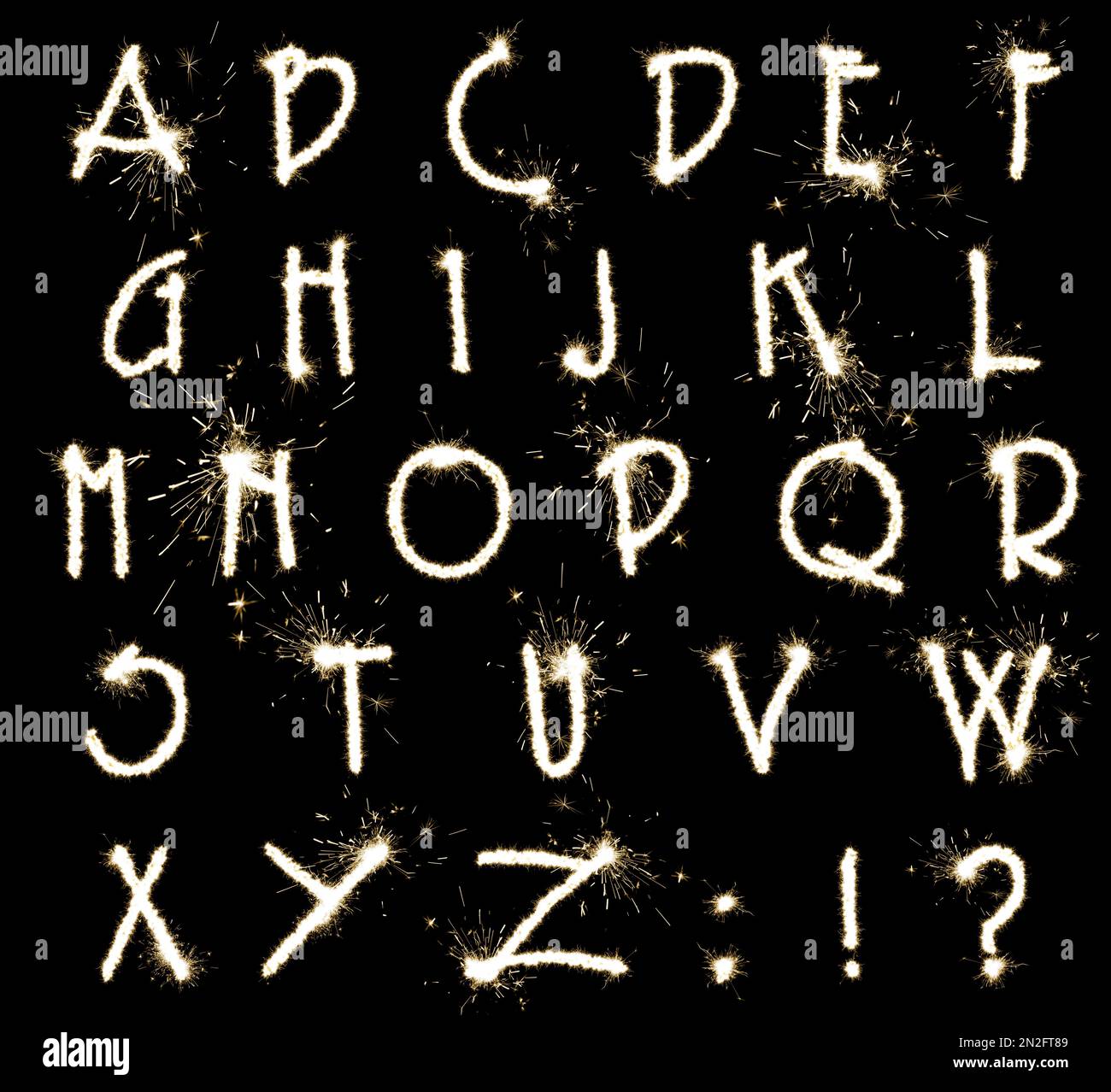 Set with letters made of sparkler on black background Stock Photo - Alamy