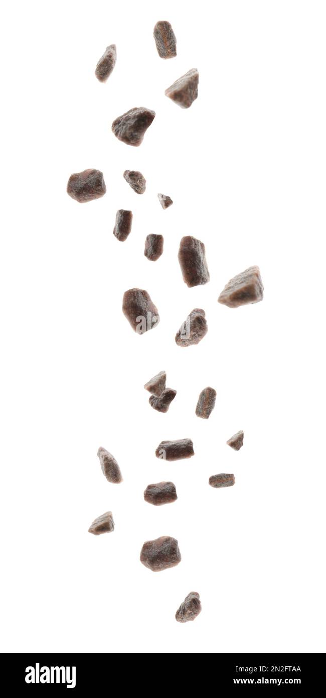 Black salt crystals falling on white background Stock Photo - Alamy