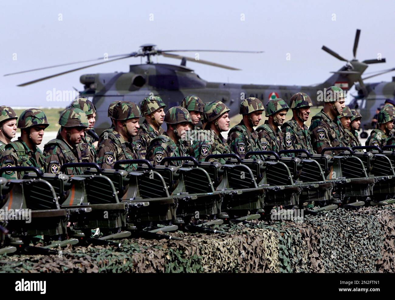 Lebanese army soldiers stand in front of French weapons at the Rafik ...