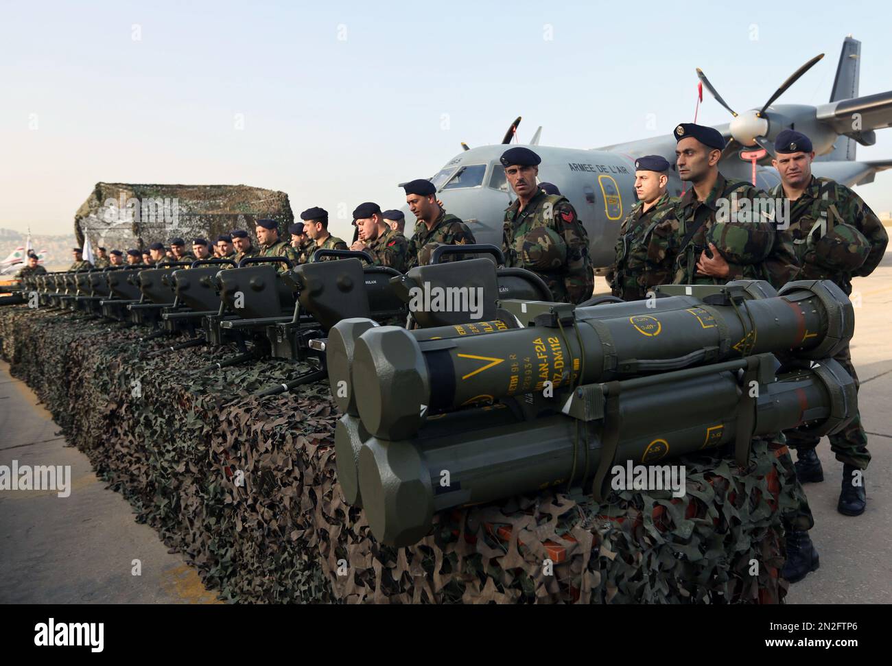 Lebanese army soldiers stand in front of French weapons at the Rafik ...