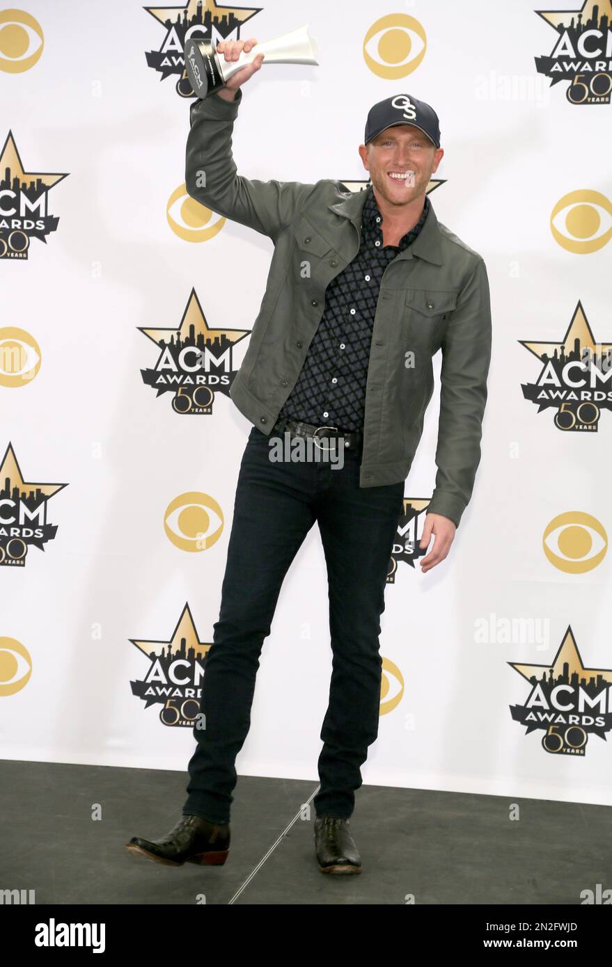 Cole Swindell poses in the press room with the award for new artist of ...