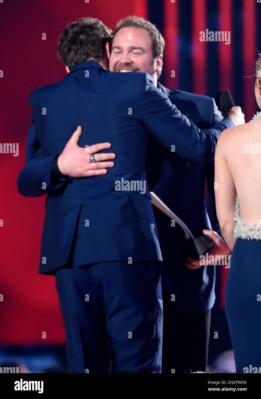 Brett Eldredge, left, presents the award for single record of the year ...