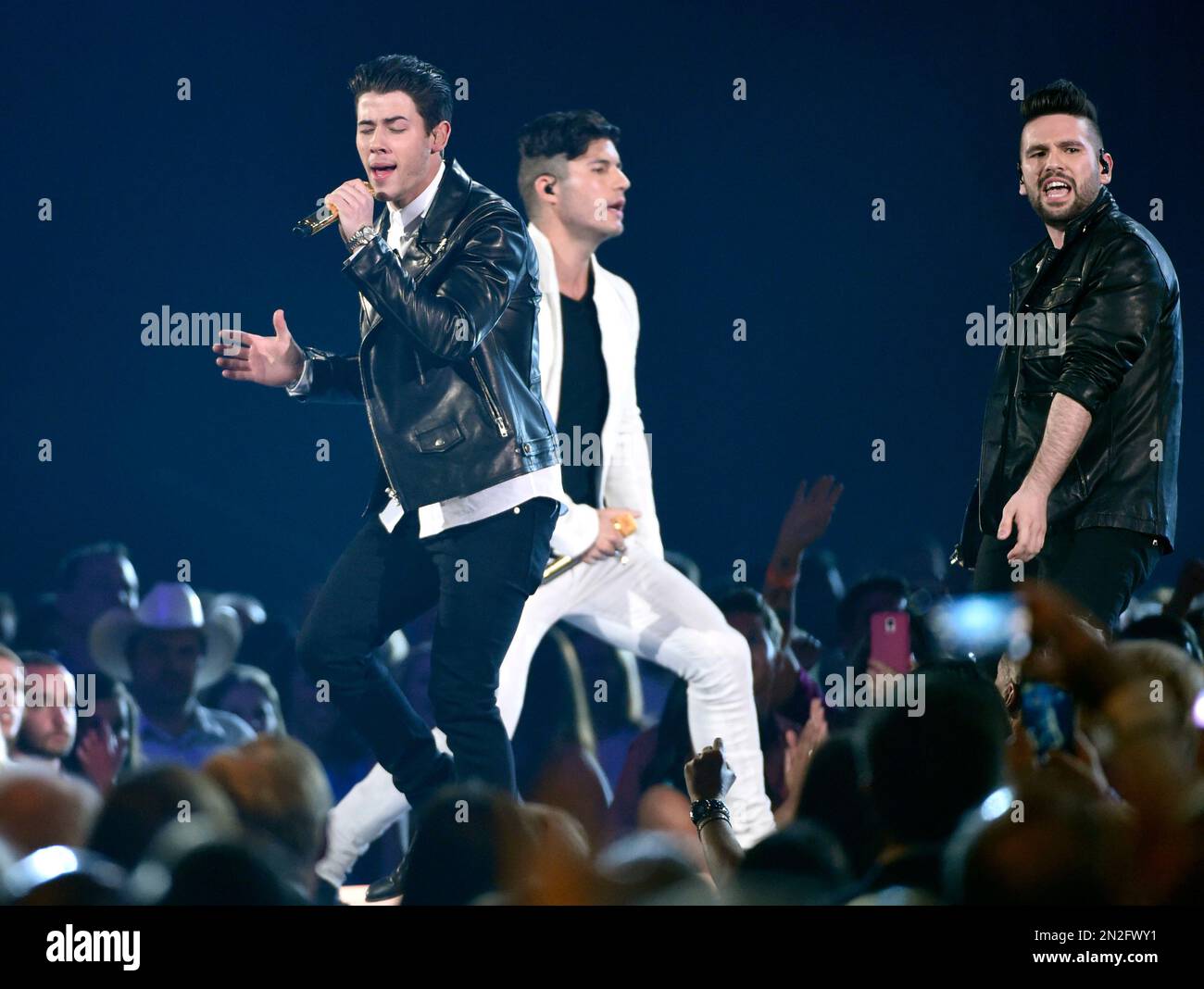 Nick Jonas, from left, Dan Smyers and Shay Mooney, of Dan + Shay ...